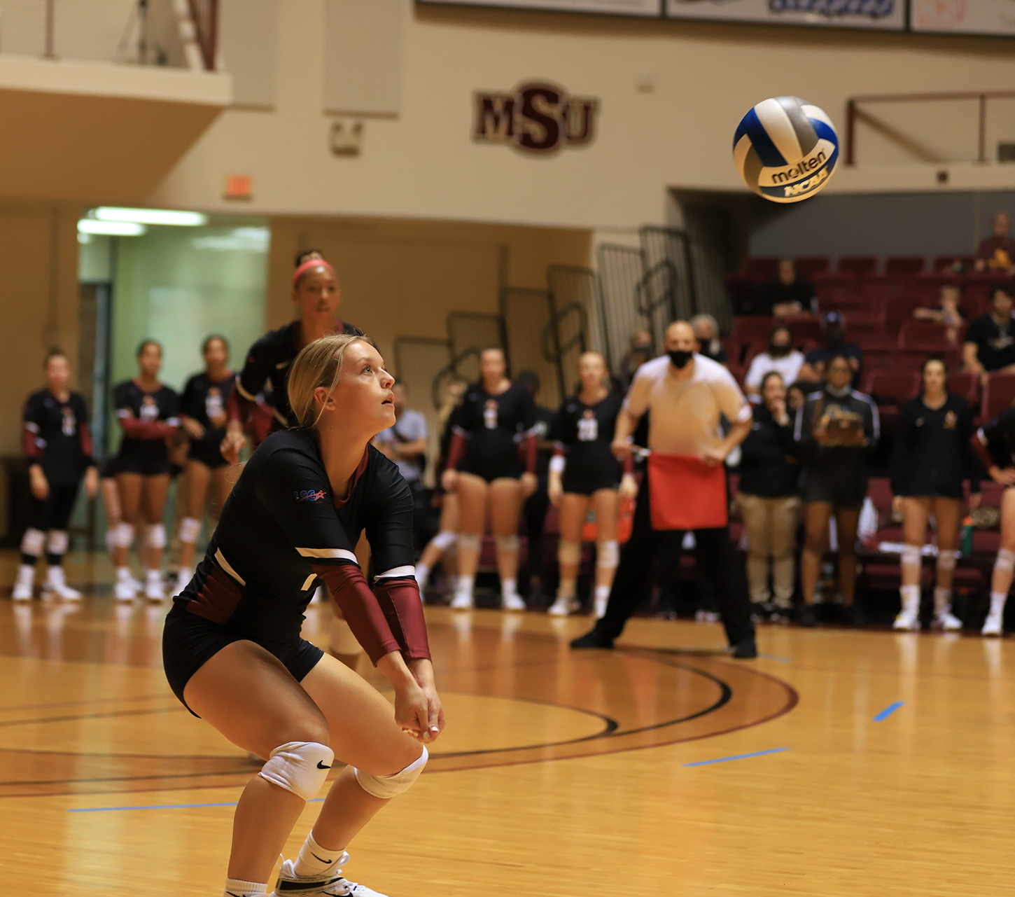 Business freshman, Regan Williams passing the ball from a tap off the ...